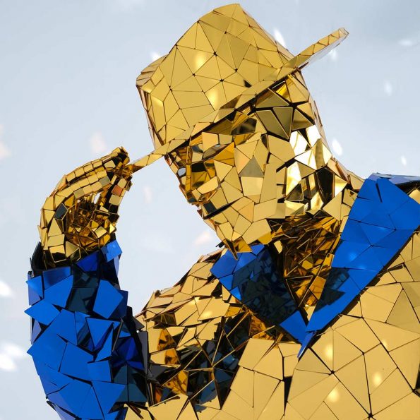 Yellow and blue Mirror Man costume with broken mirror tiles