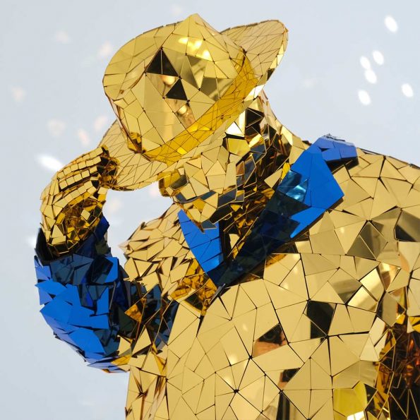 Yellow and blue Mirror Man costume with broken mirror tiles